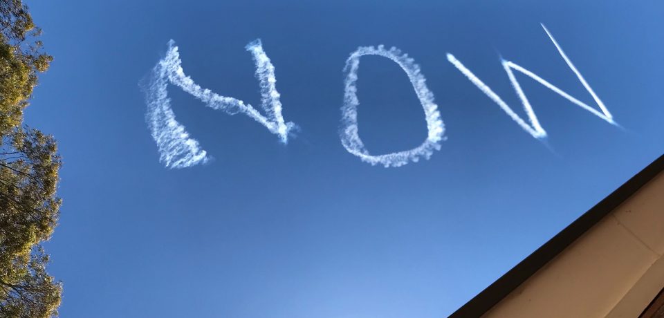 Tathra's Matthew Nott takes to the sky above Canberra - climate action NOW!
